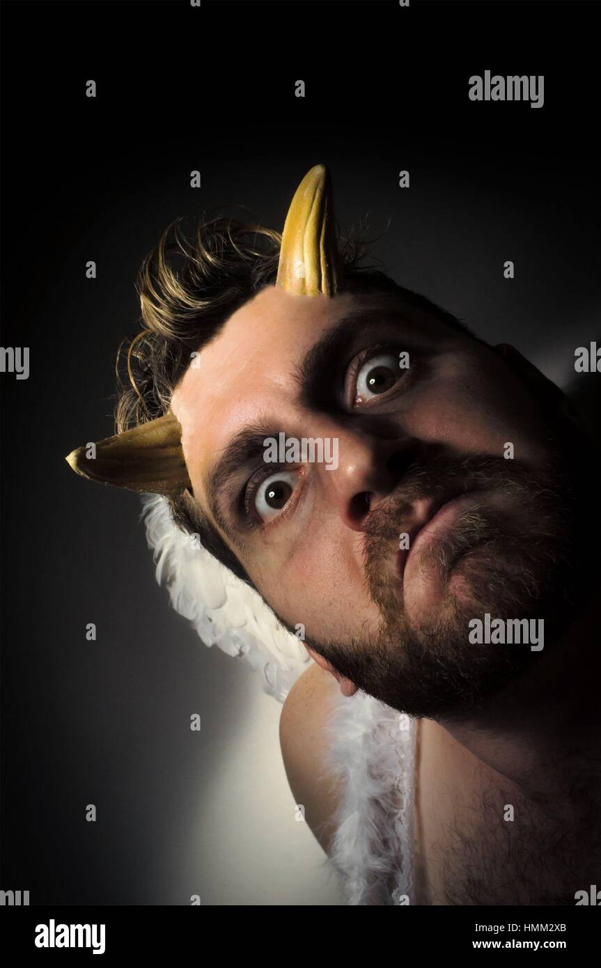 Fallen angel satan with feathered wings and moody lighting Stock Photo ...