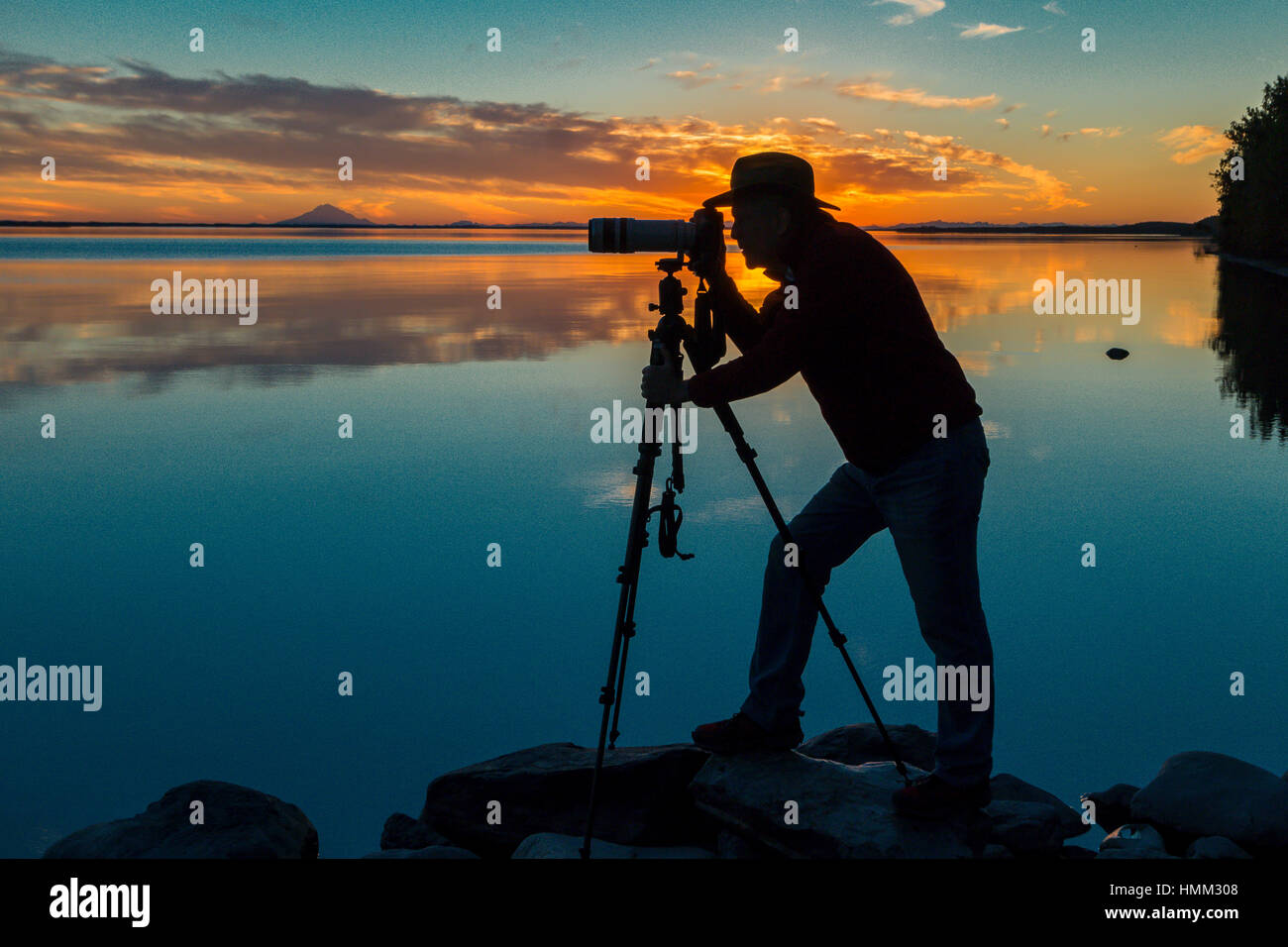 September 1, 2016, Silhouette of photographer Joe Sohm shooting Mt ...