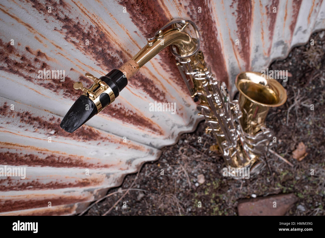 Jazz musical instrument saxophone with rusty fence background Stock ...