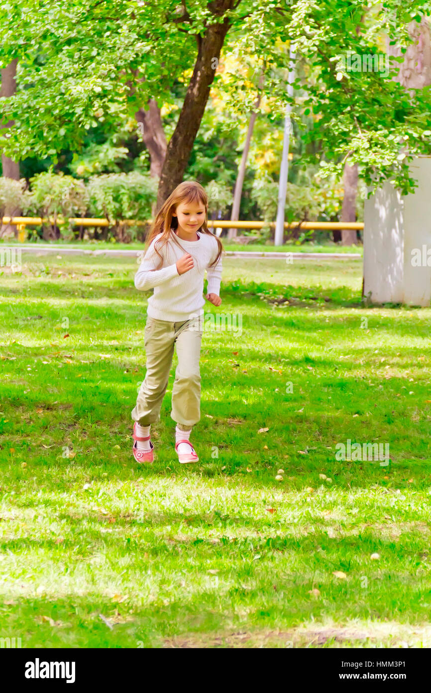 Photo of cute running girl in summer Stock Photo - Alamy