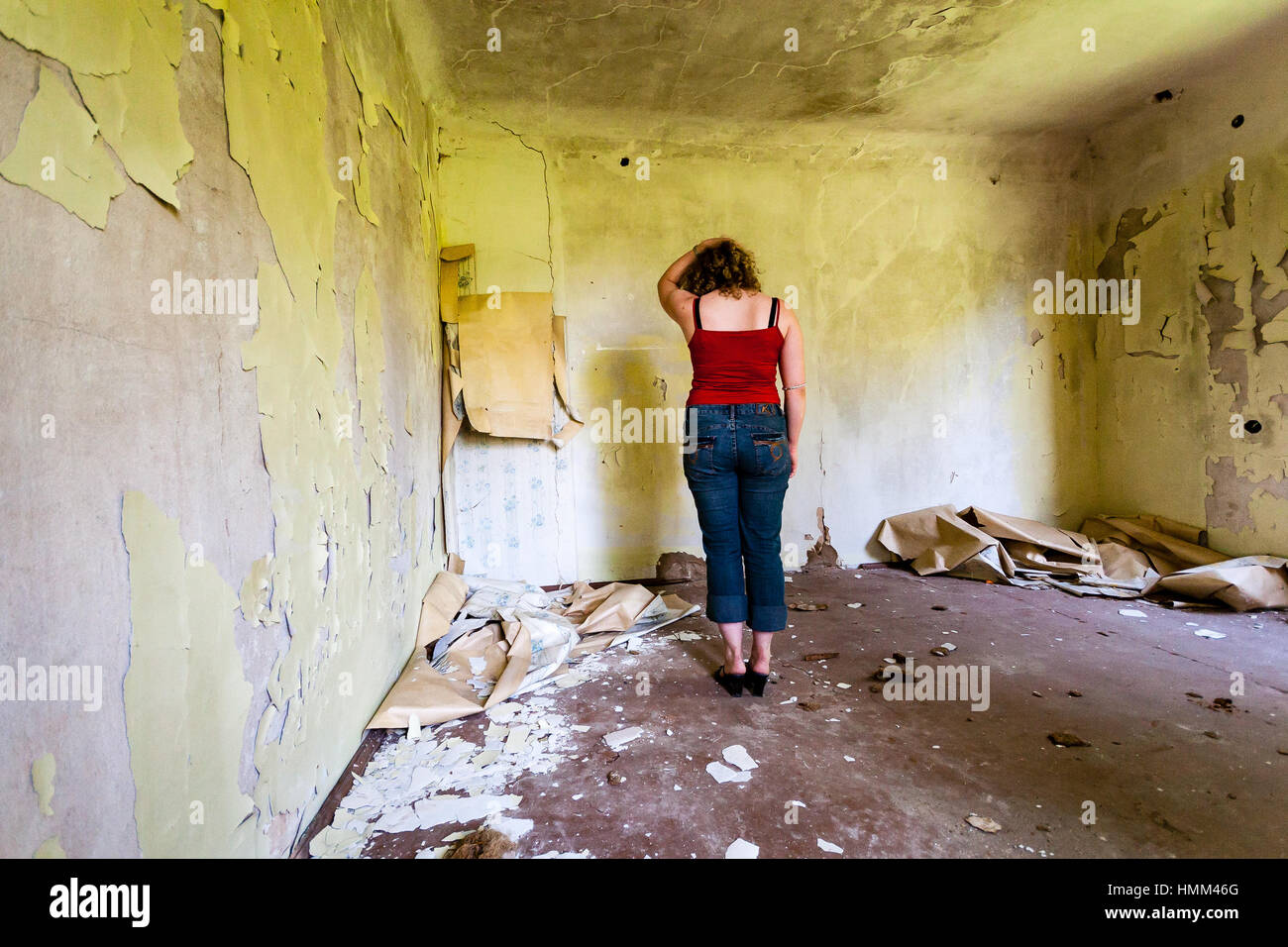 depressed young girl in old house interior trashing walls Stock Photo ...