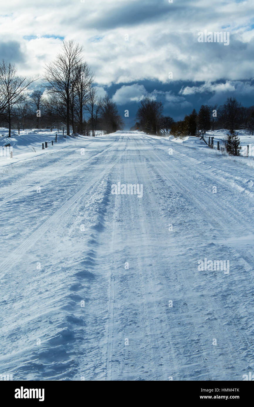 Snow blowing over road hi-res stock photography and images - Alamy