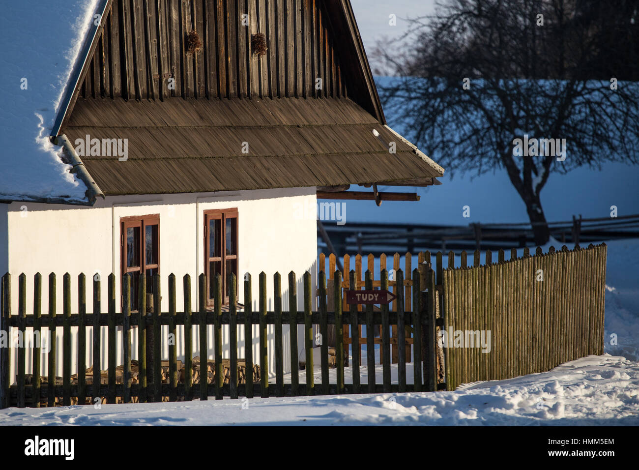 Traditional wooden timbered cottage in winter. Folk museum in Vesely ...