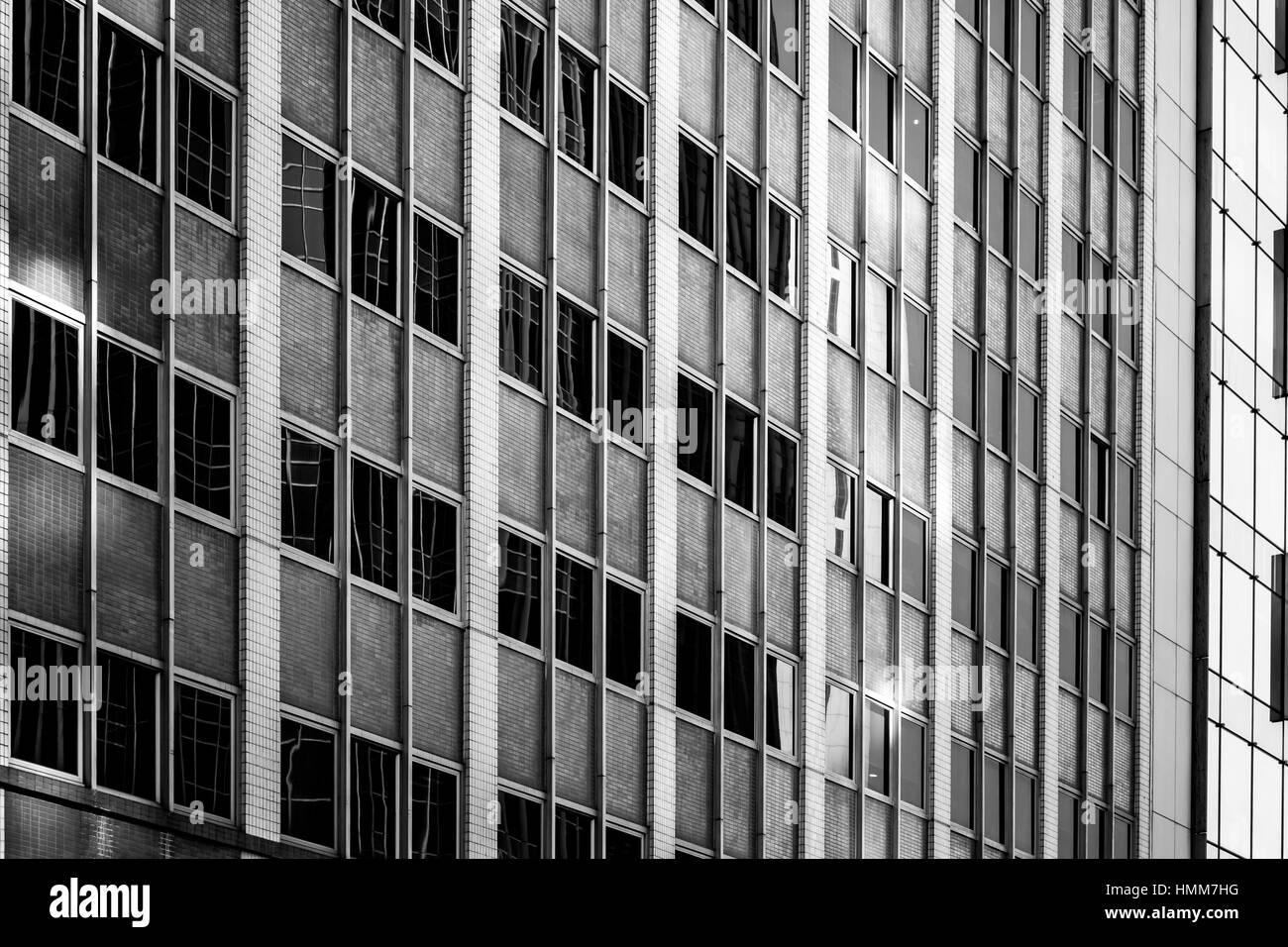 Windows of commercial building in Hong Kong with B&W color Stock Photo ...
