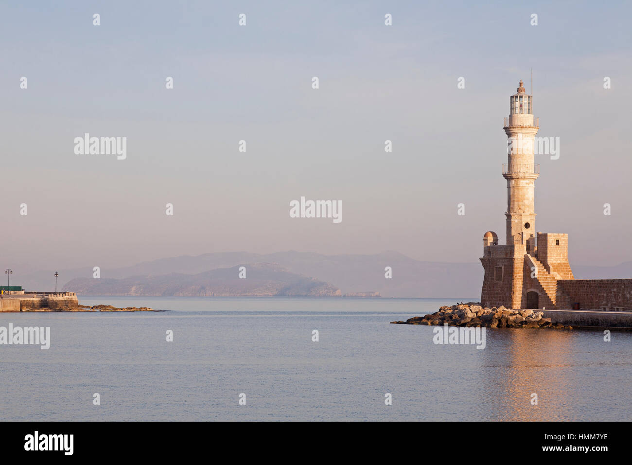 Chania lighthouse overlooking the entrance to Venetian Harbour in the ...