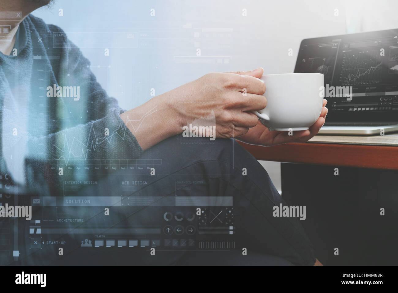 success businessman hand using smart phone,digital tablet docking smart keyboard,coffee cup on ...