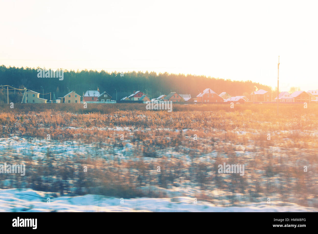beautiful winter landscape. cottages in a sunlight Stock Photo - Alamy