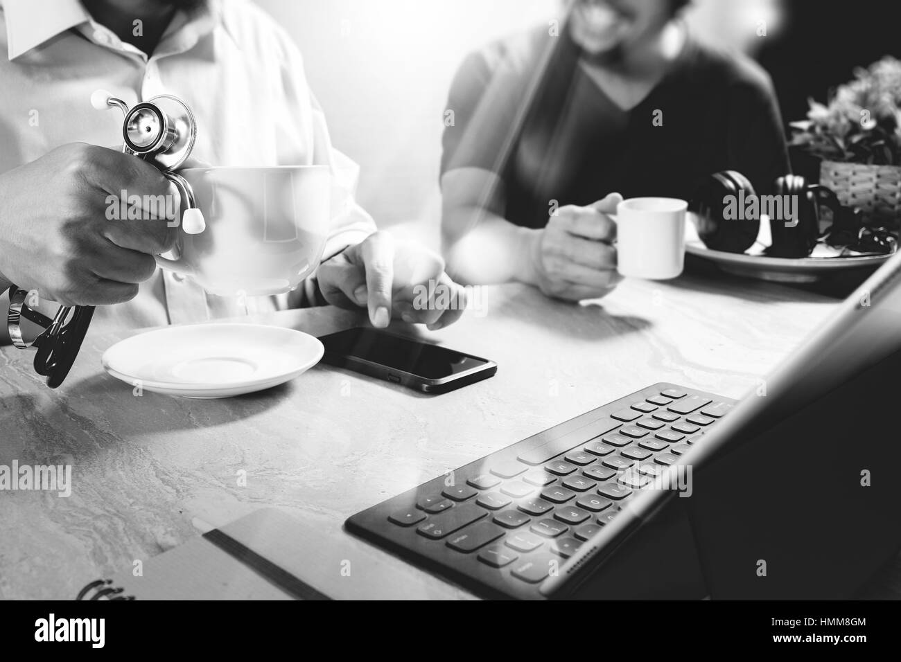 Medical doctor team taking coffee break.using digital tablet docking ...