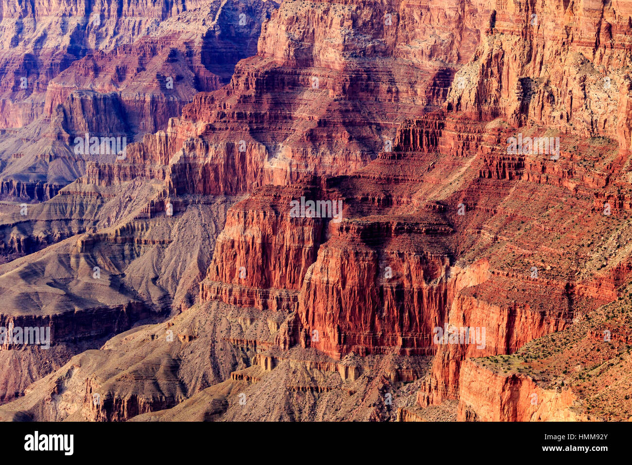 Towering, rocky cliffs exhibit their brilliant color in the eastern ...