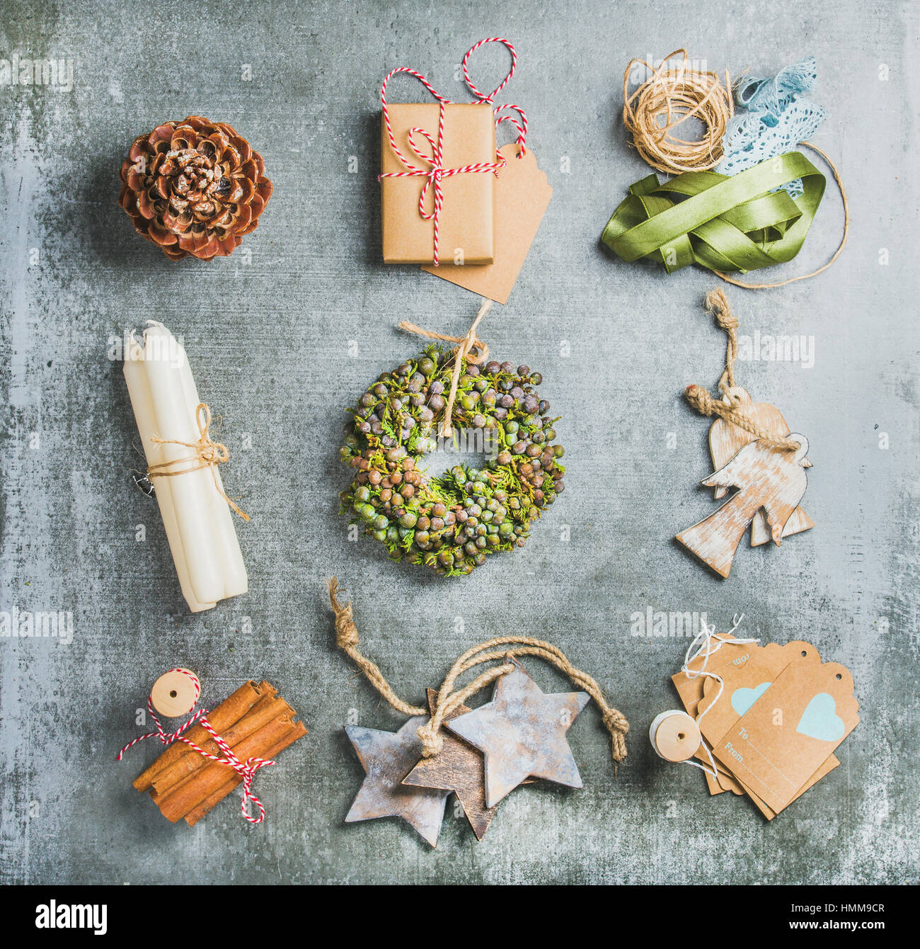 Christmas related objects on grey concrete table background, top view ...