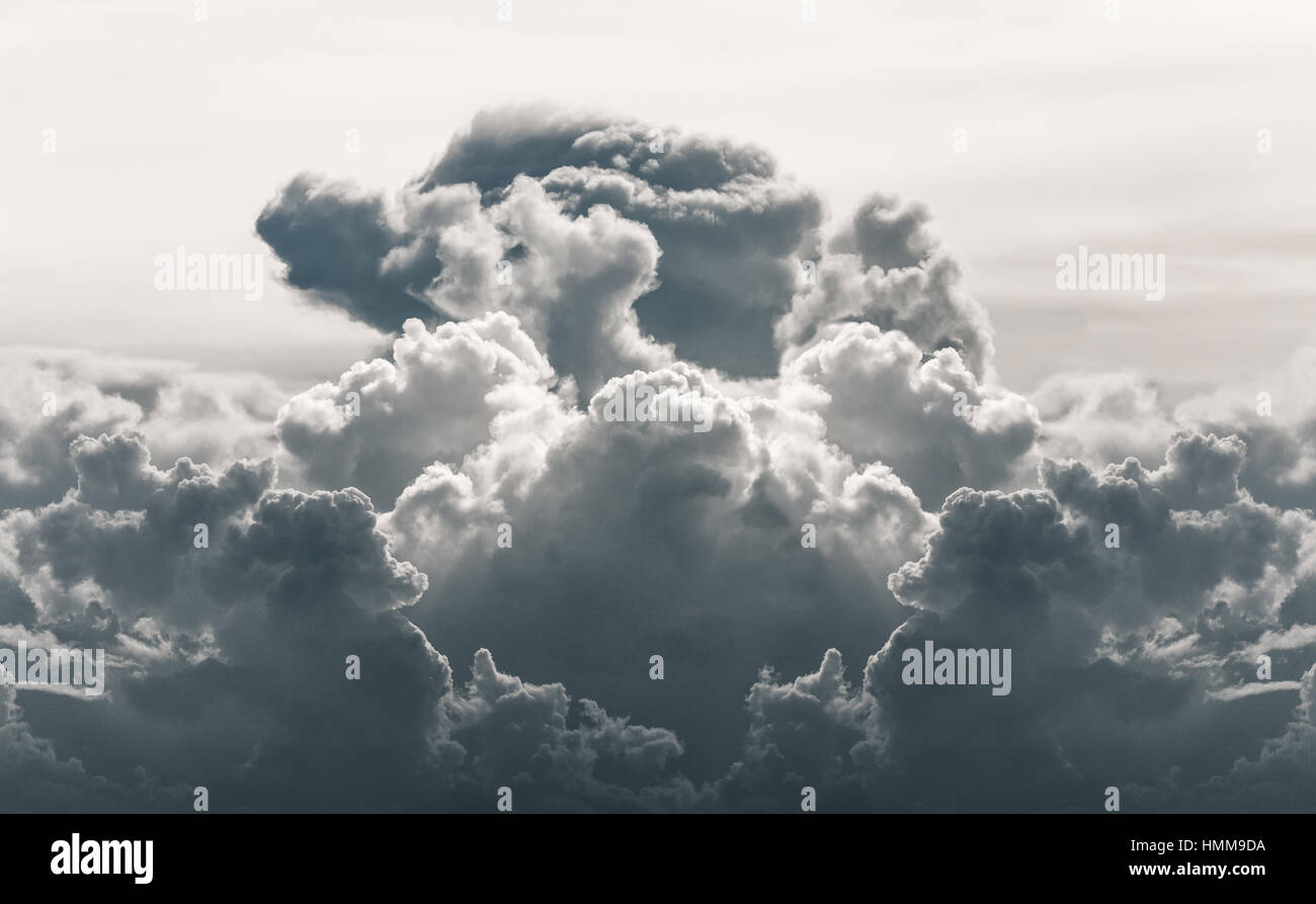 Dark cloud expand from blowing wind on cloudy sky in desaturated color ...