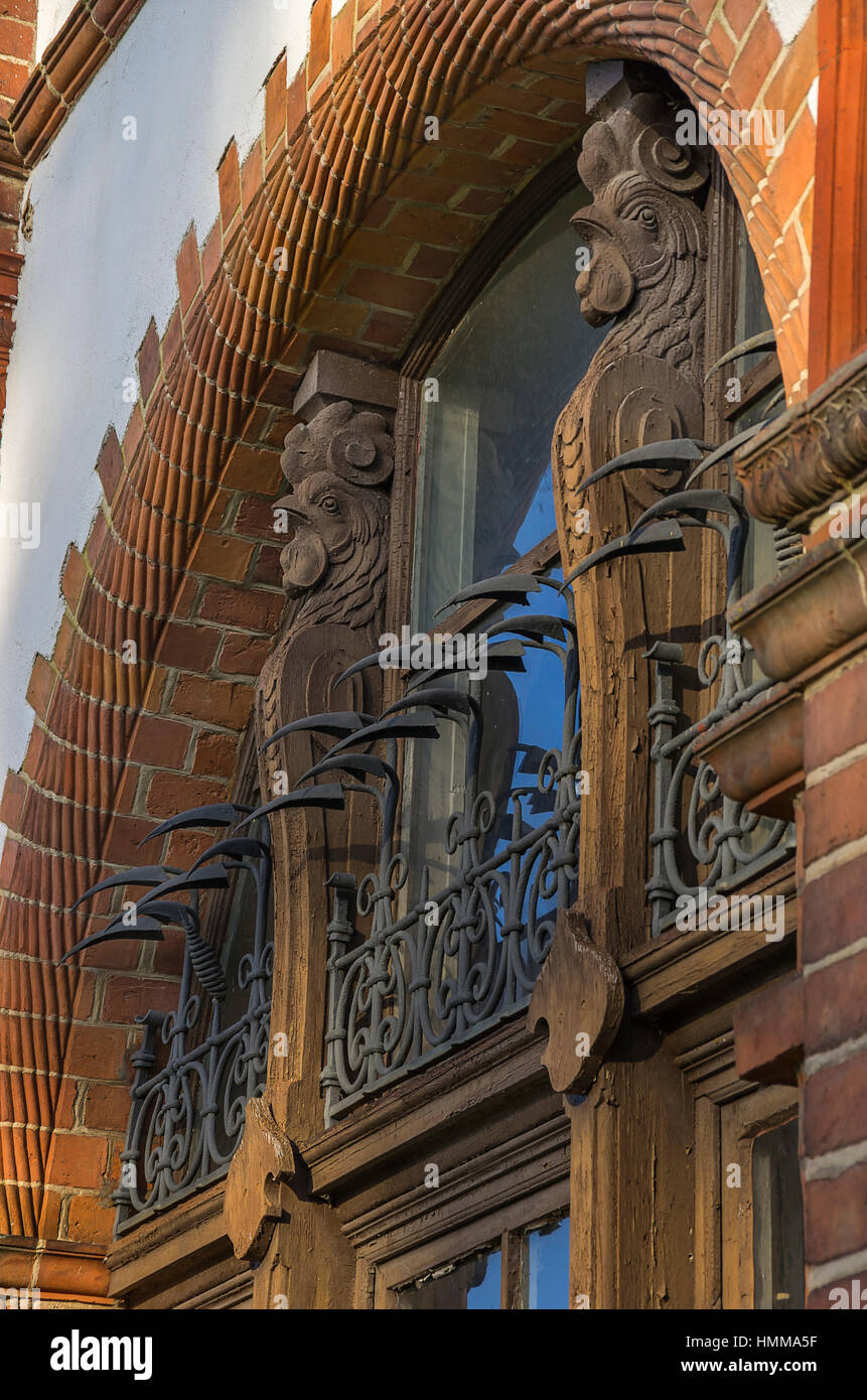 Historical arched window with mullions shaped like roosters, Basedow ...