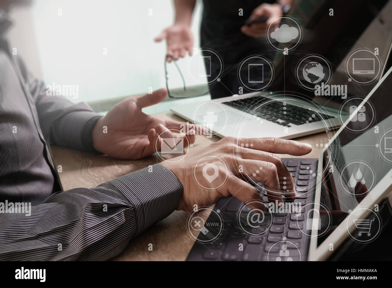 Designer Businessman hand using smart phone,mobile payments online shopping,omni channel,digital ...