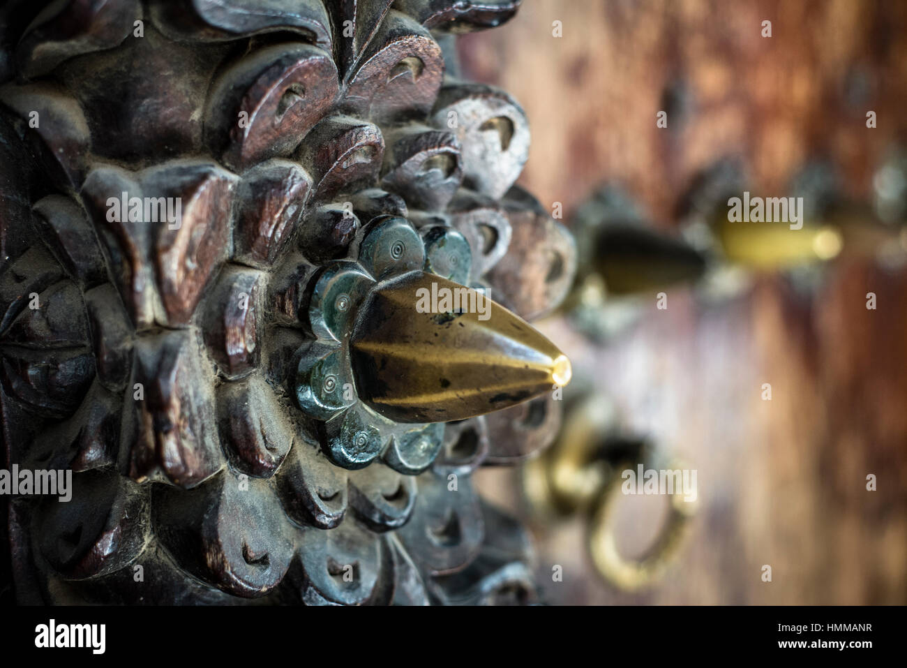 Wooden door with pointed brass pommels of a building in Stone Town ...
