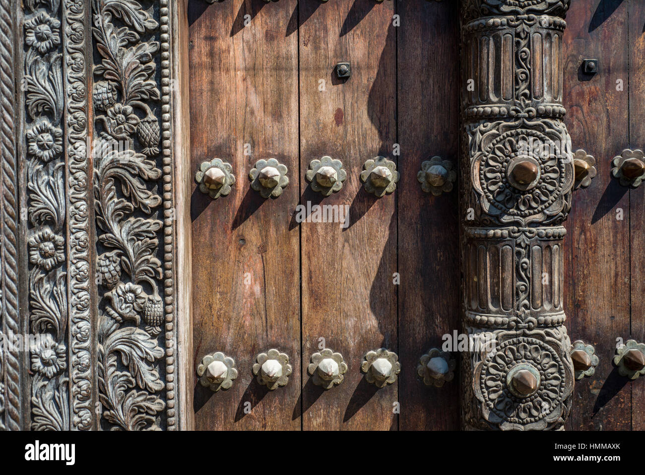 Wooden door with pointed brass pommels of a building in Stone Town ...