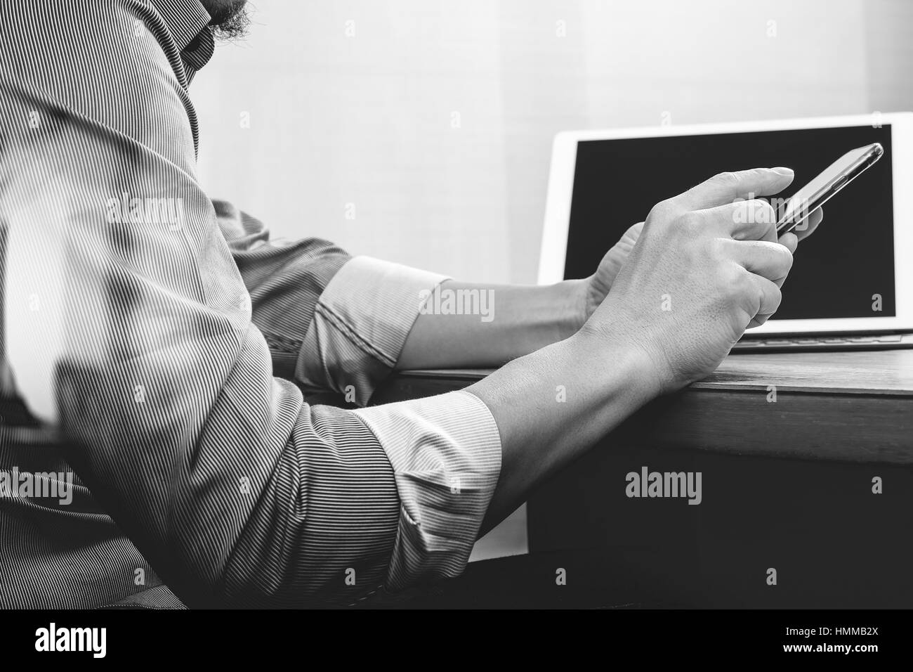 success businessman hand using eyeglass,smart phone,digital tablet docking smart keyboard on ...