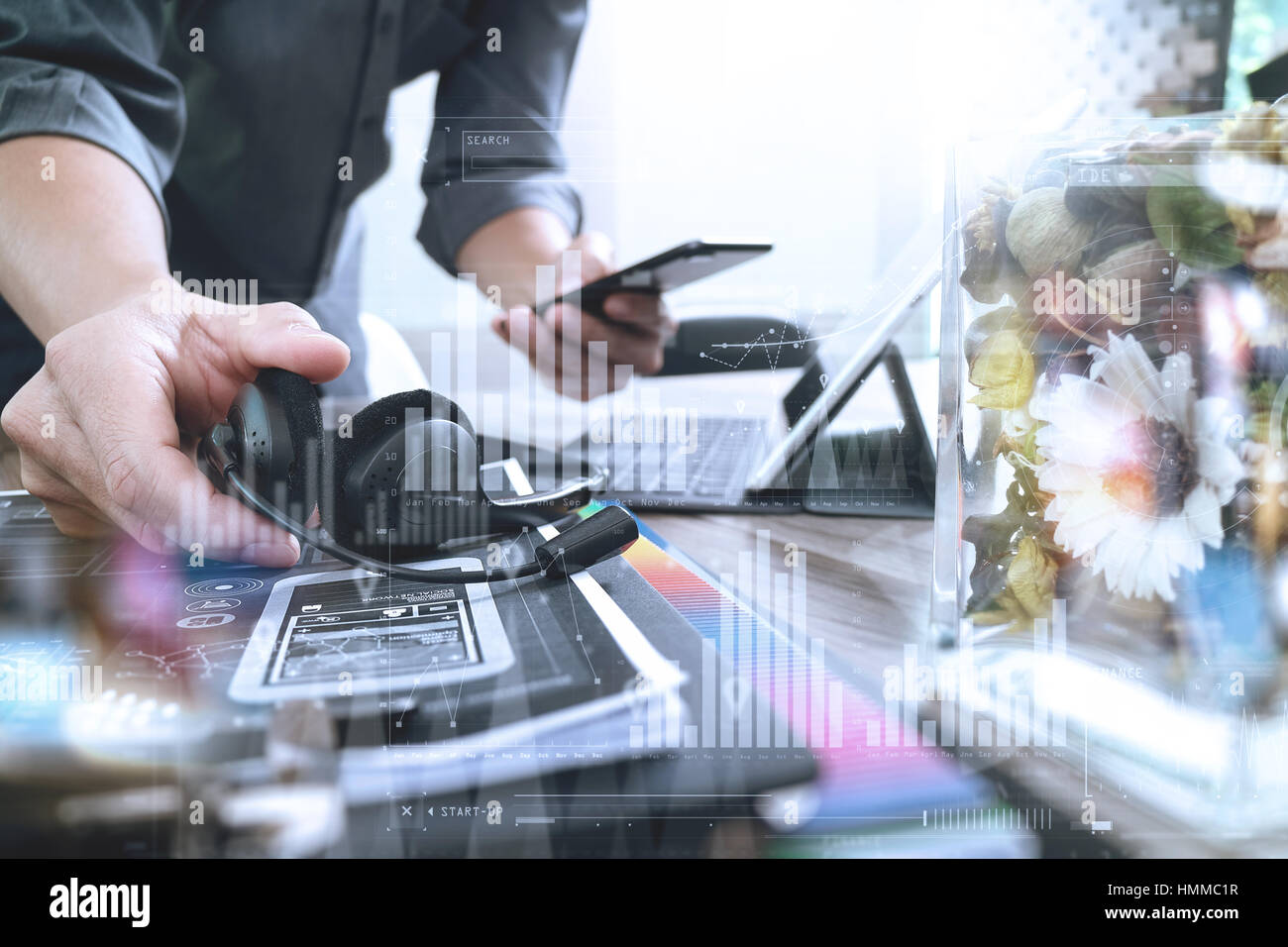 Man using VOIP headset with digital tablet computer docking keyboard ...