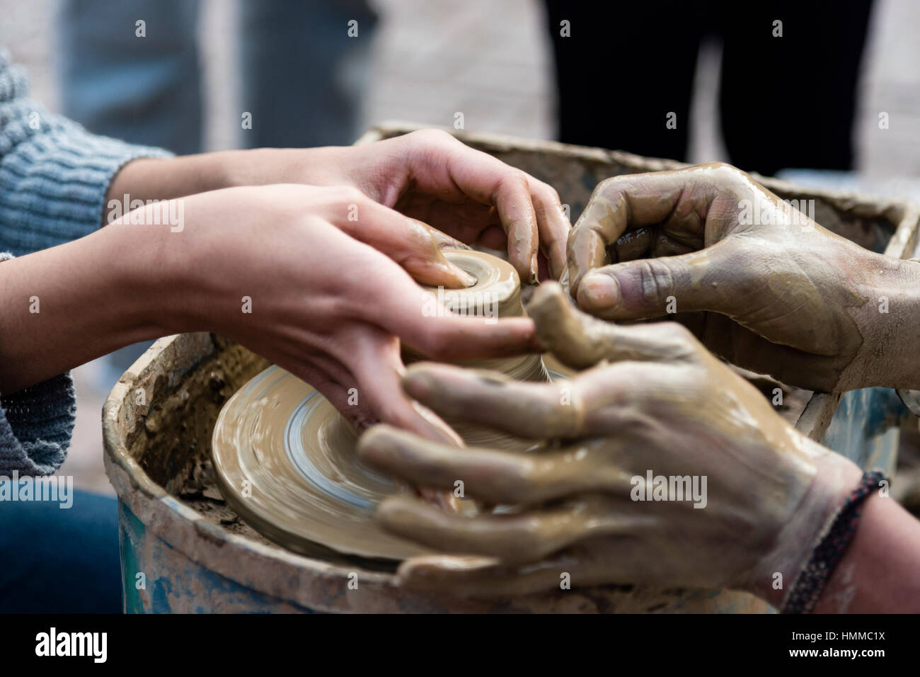 A potter giving pottery making lesson Stock Photo - Alamy