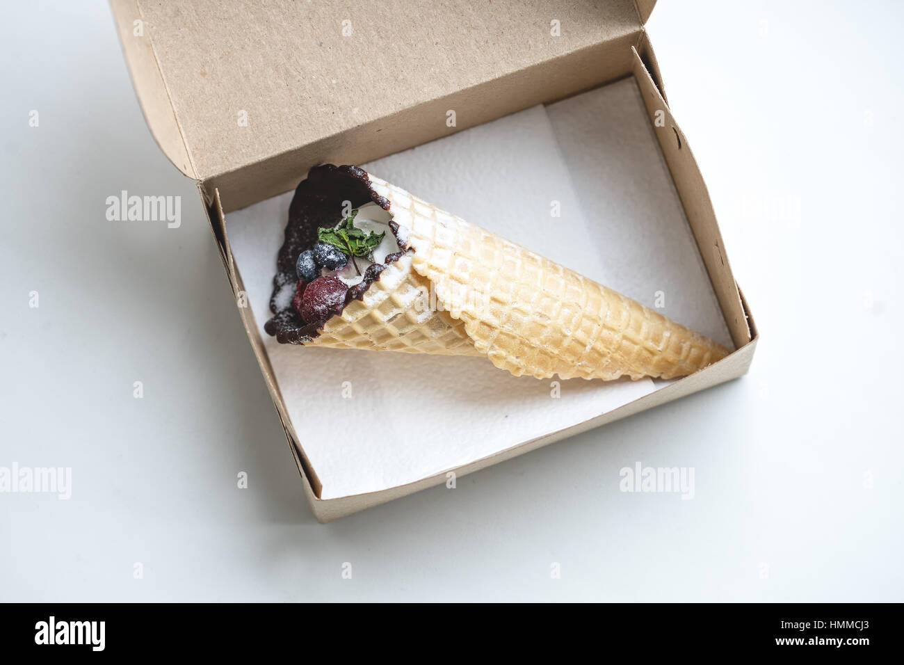 Ice cream with berry in ice cream cone. Homemade berry ice cream cones ...