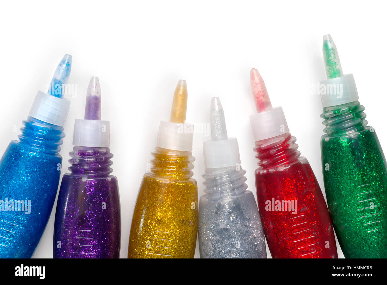 Set of open colored glitter glue tubes. Isolated on white with clipping ...