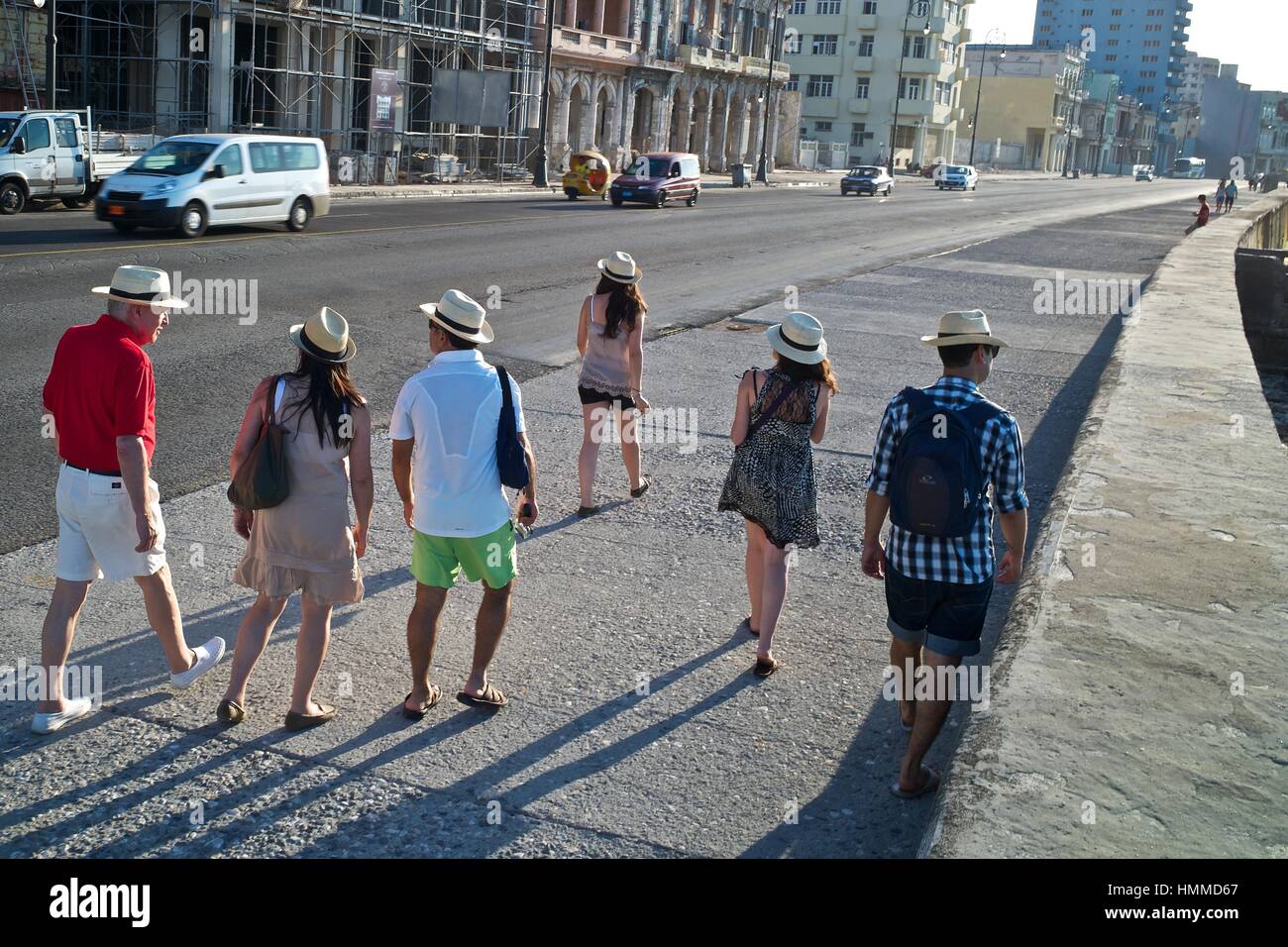 Tourists explore El Malecon, Cuba´s famous sea walk Stock Photo - Alamy