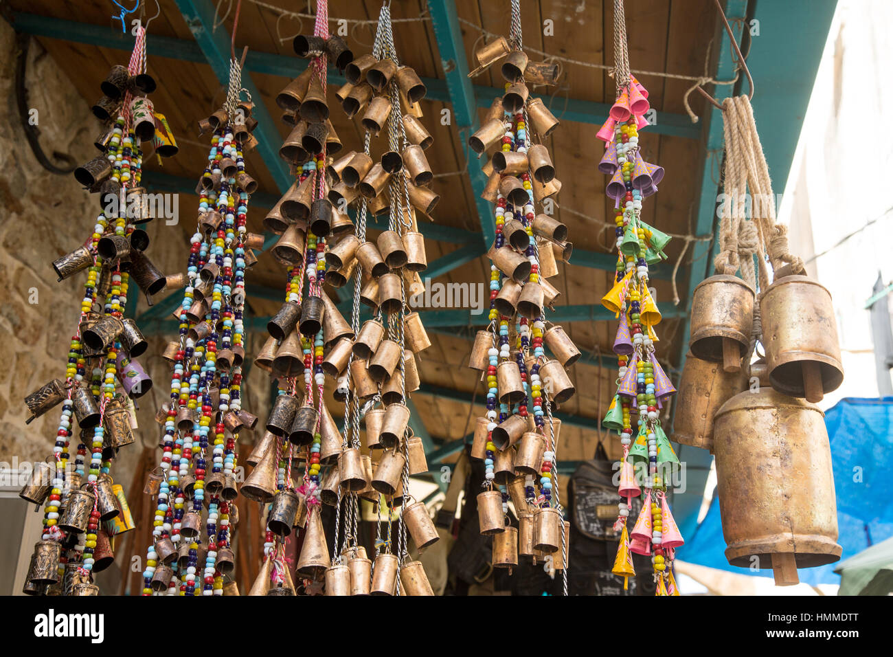 Aged decorative souvenir bells of different size selling on arabic ...
