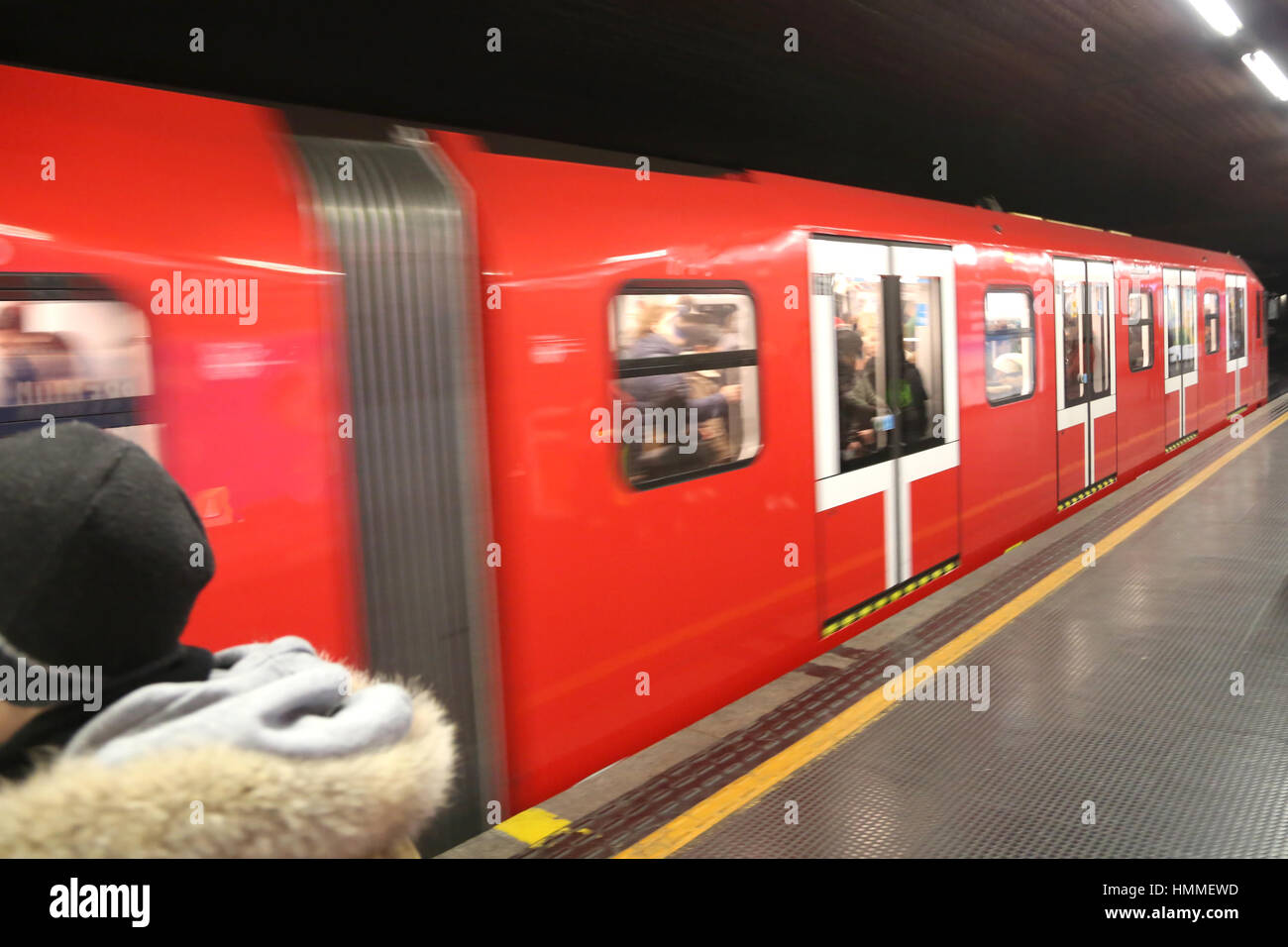 Red subway car runs fast in underground station Stock Photo - Alamy