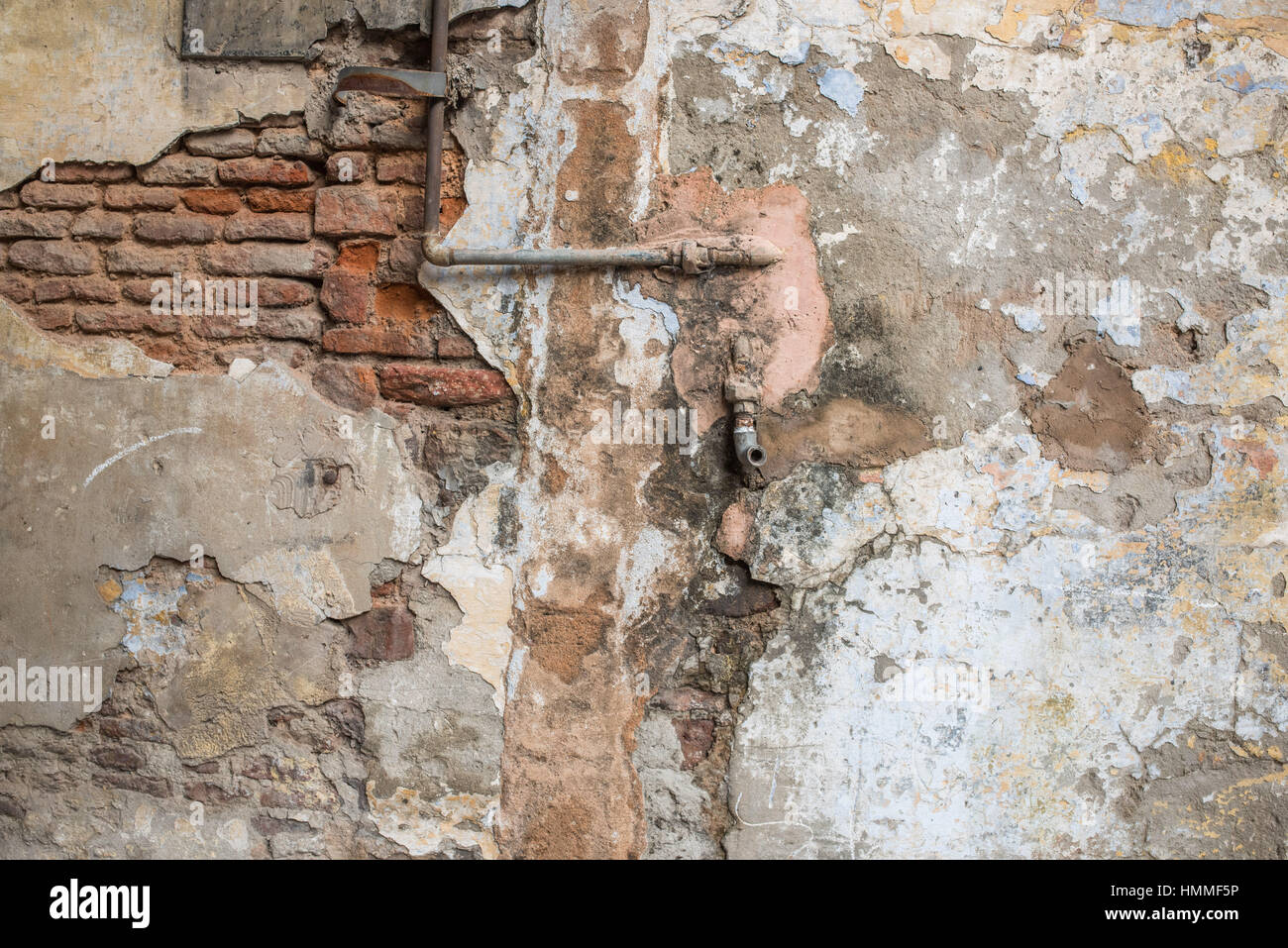 Drainage pipe protruding from dilapidated wall in Delhi Stock Photo - Alamy
