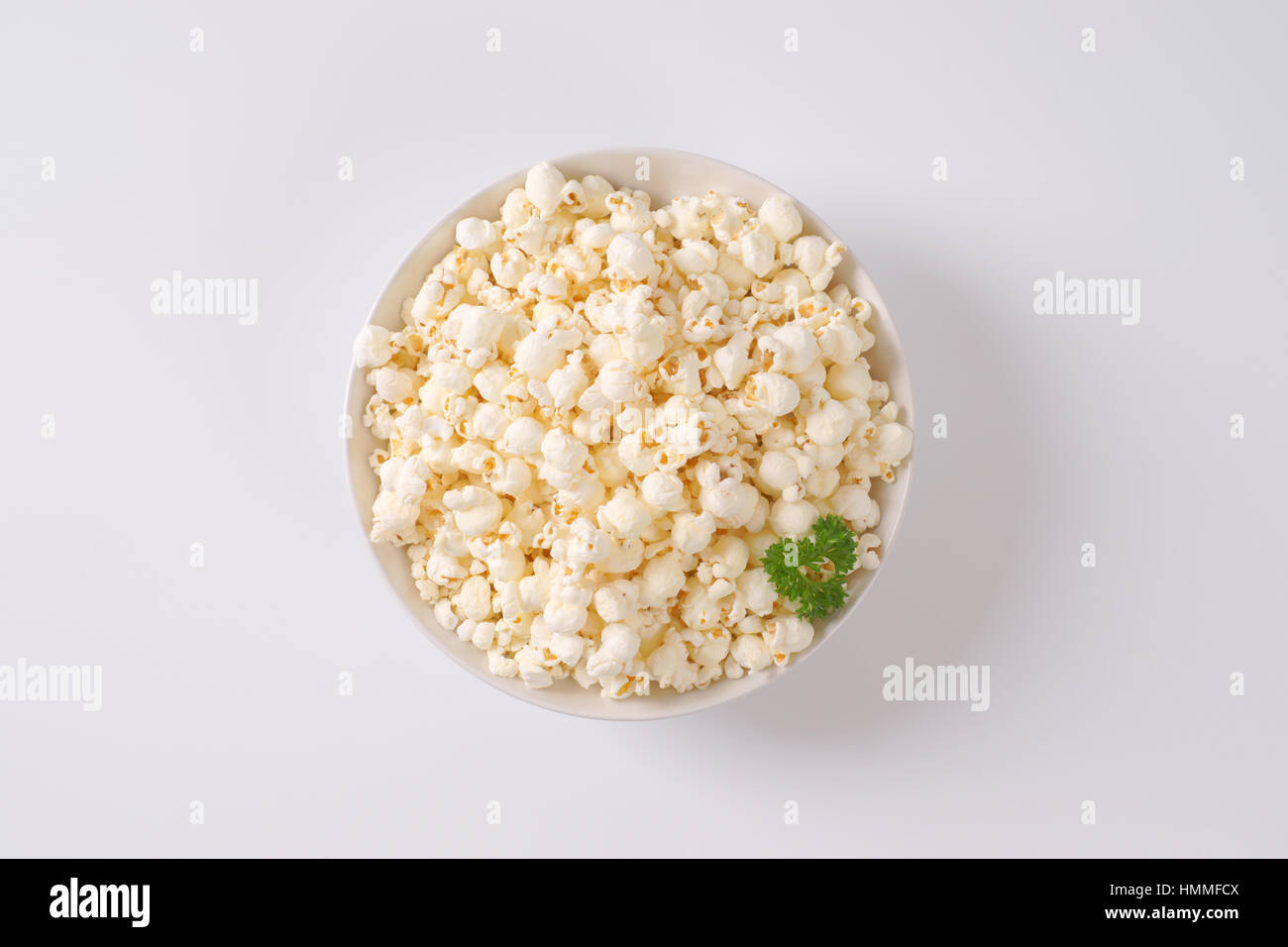 bowl of fresh popcorn on off-white background with shadows Stock Photo ...