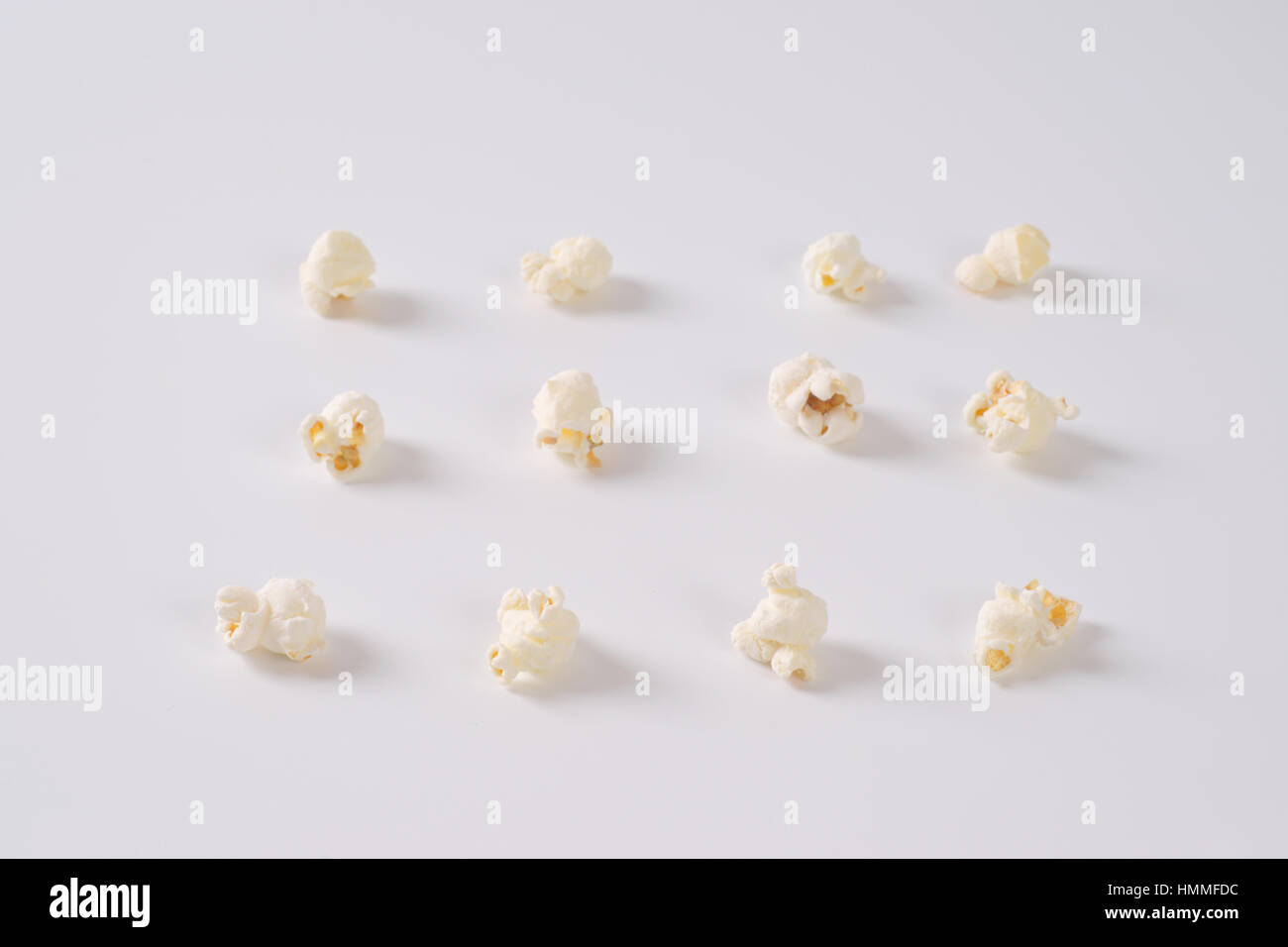 pieces of fresh popcorn arranged on white background Stock Photo - Alamy