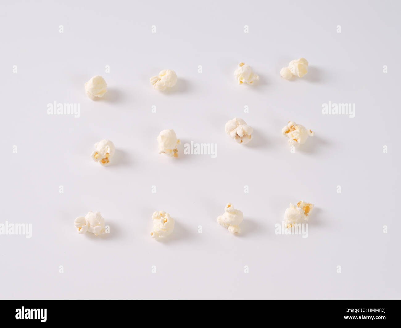 pieces of fresh popcorn arranged on white background Stock Photo - Alamy
