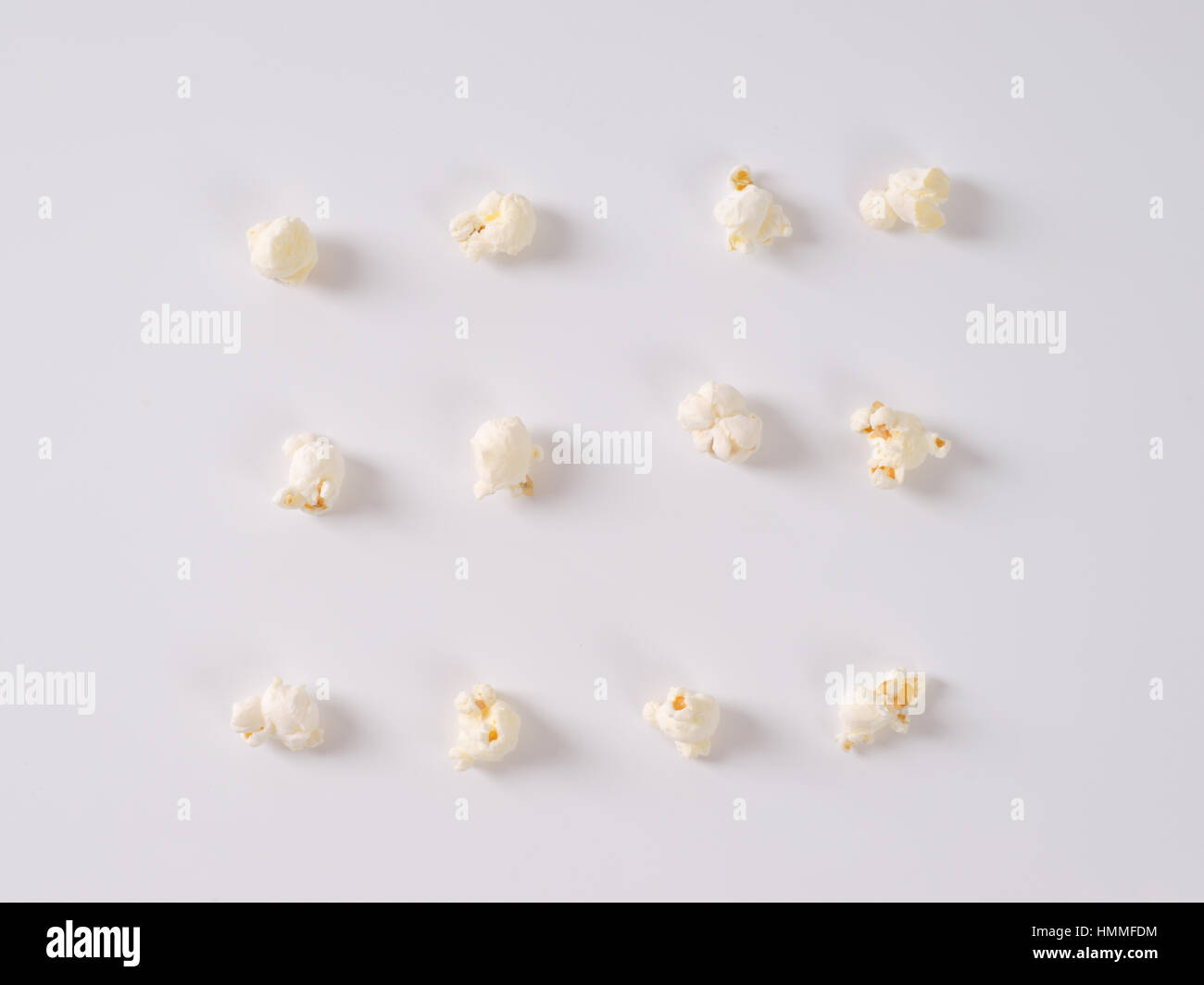 pieces of fresh popcorn arranged on white background Stock Photo - Alamy