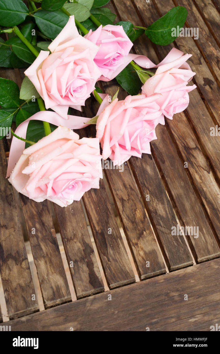 Pink blooming roses on wood Stock Photo - Alamy