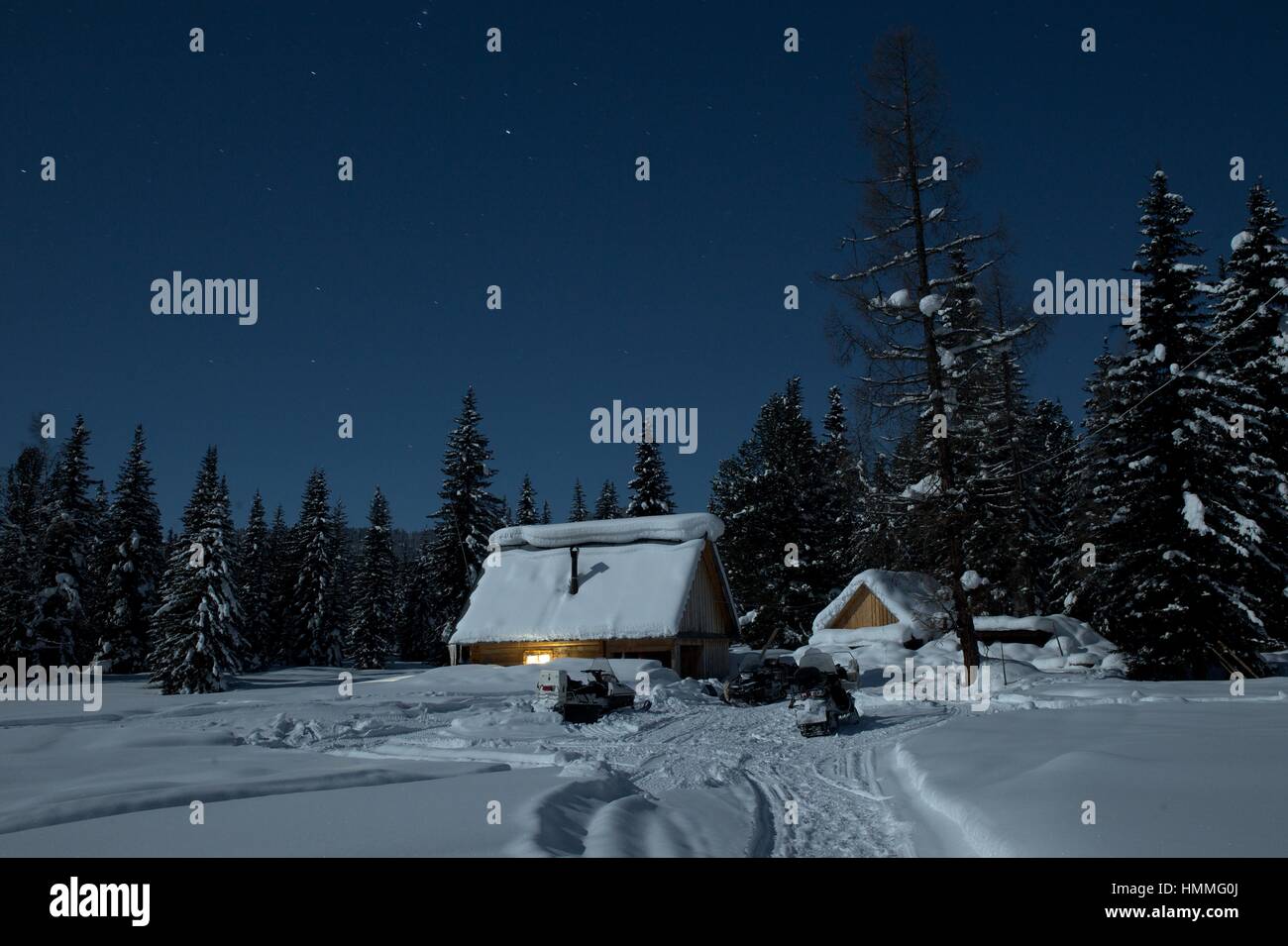 winter wooden house at night Stock Photo - Alamy