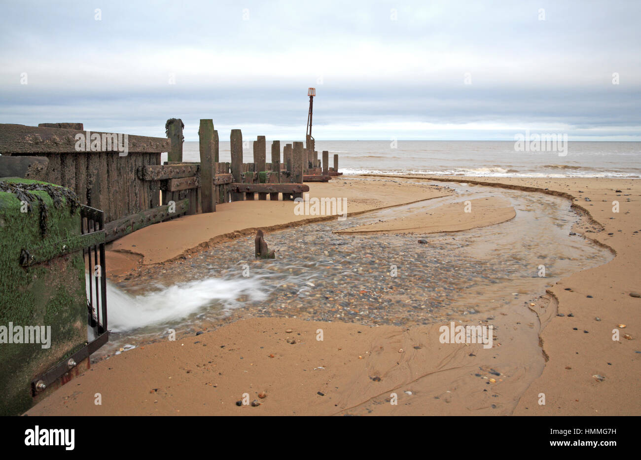 The outfall of the River Mun on the beach at Mundesley-on-Sea, Norfolk ...