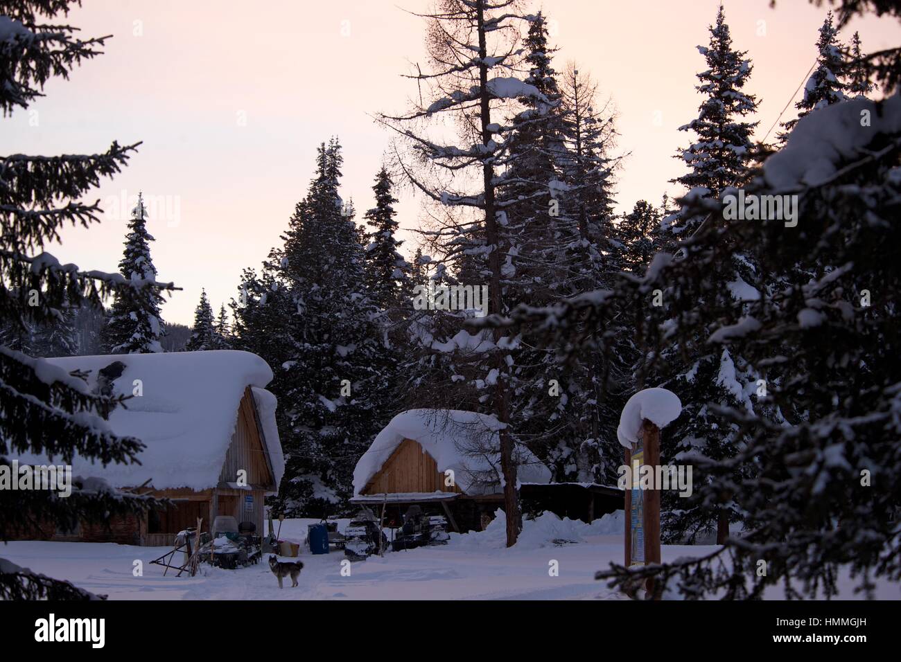 Traditional old wooden house in winter on sunset background Stock Photo ...