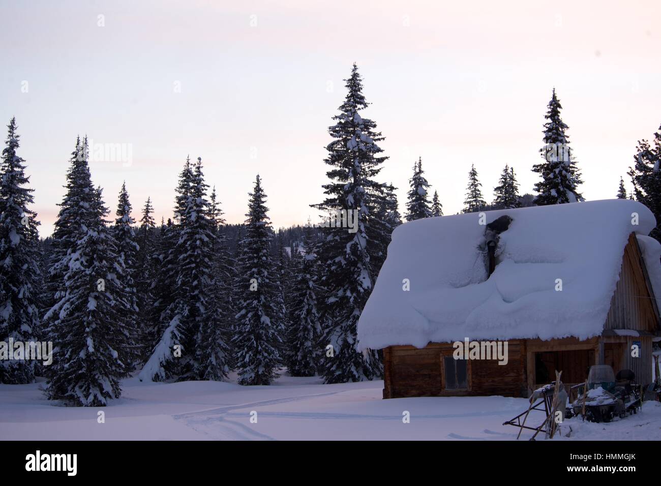 Traditional old wooden house in winter on sunset background Stock Photo ...