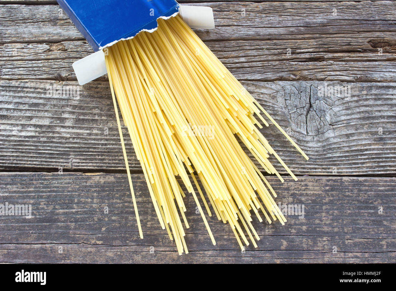 Spaghetti in cardboard box on wooden background Stock Photo - Alamy