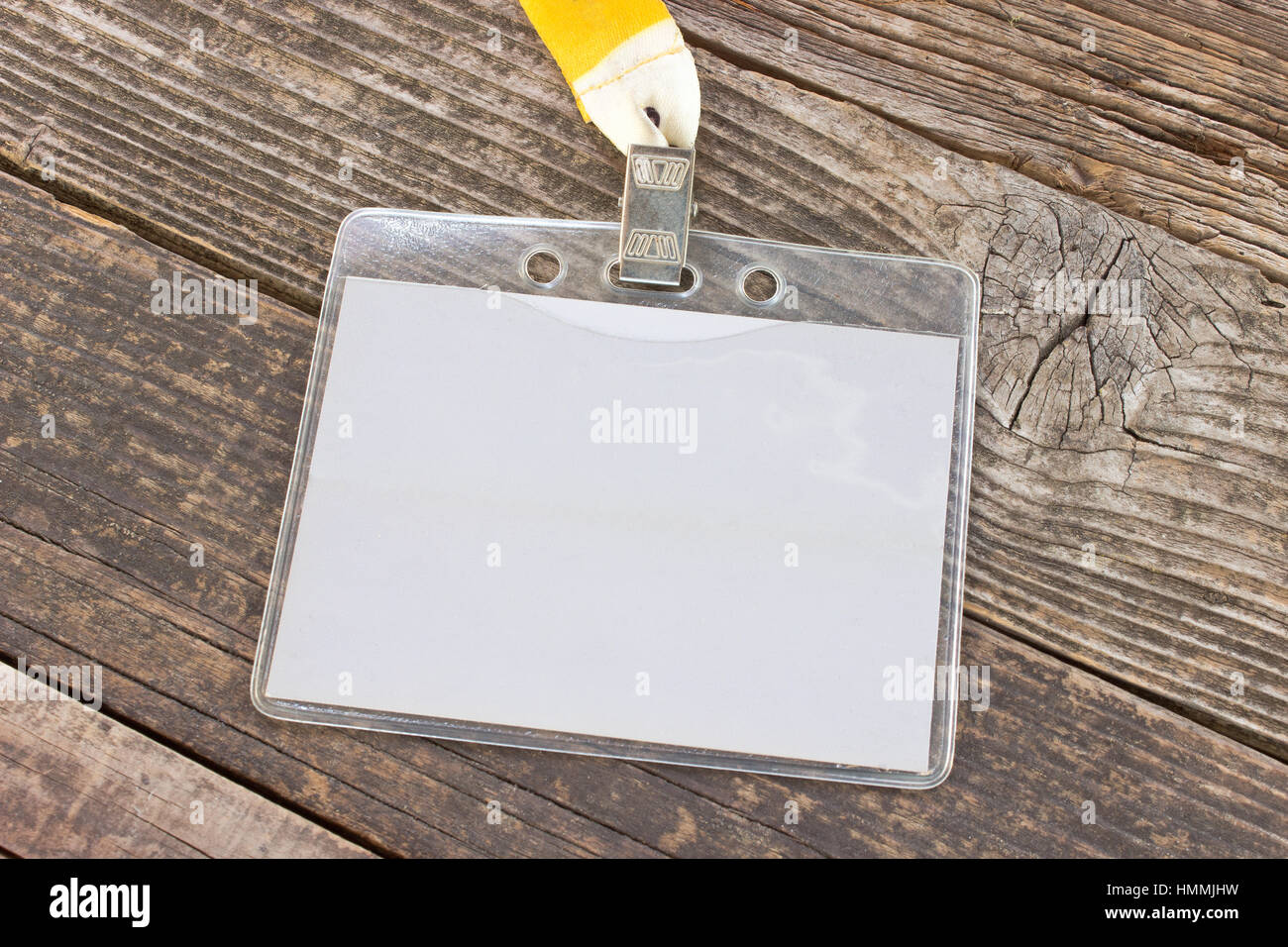 Blank ID card tag and yellow ribbon on wooden background Stock Photo ...
