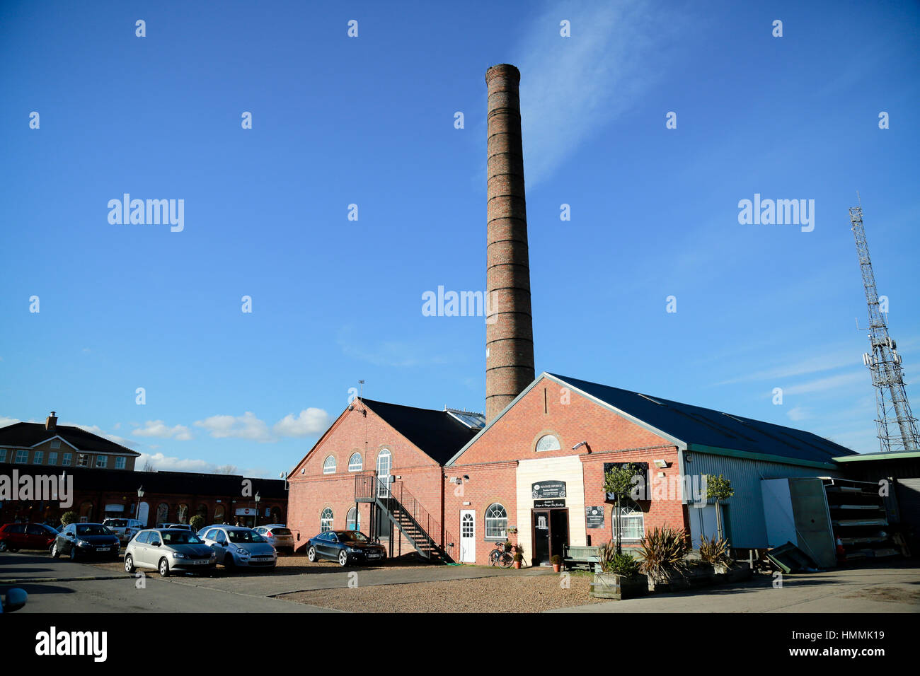 A tall industrial chimney above Victorian era factories Stock Photo - Alamy