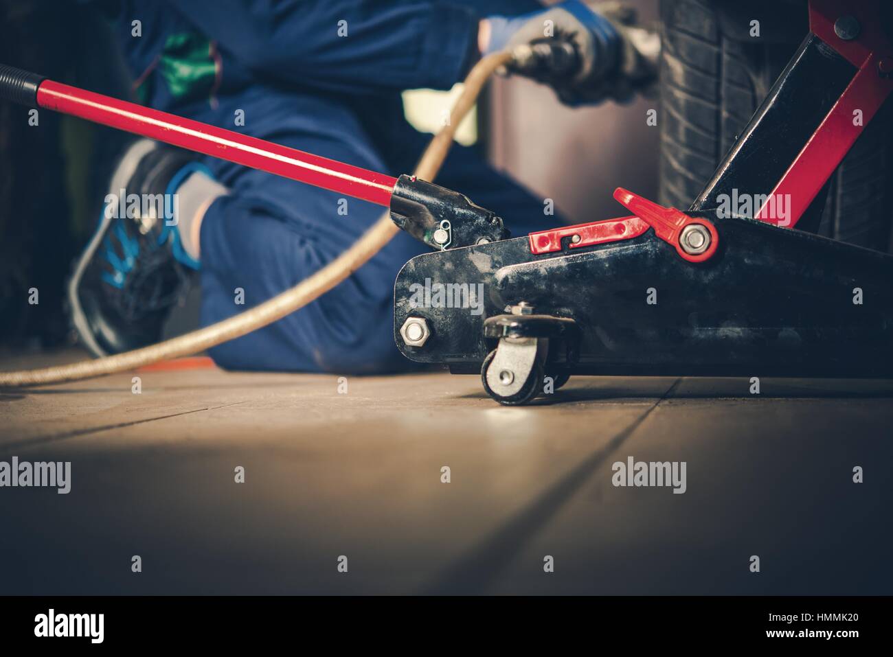 Repairing Car in the Garage. Portable Car Lift Closeup Stock Photo - Alamy