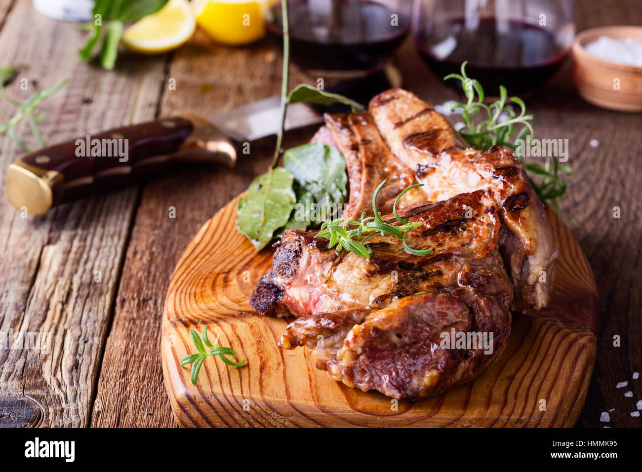 Barbecue bone ribeye steak on rustic cutting board ready to eat ...
