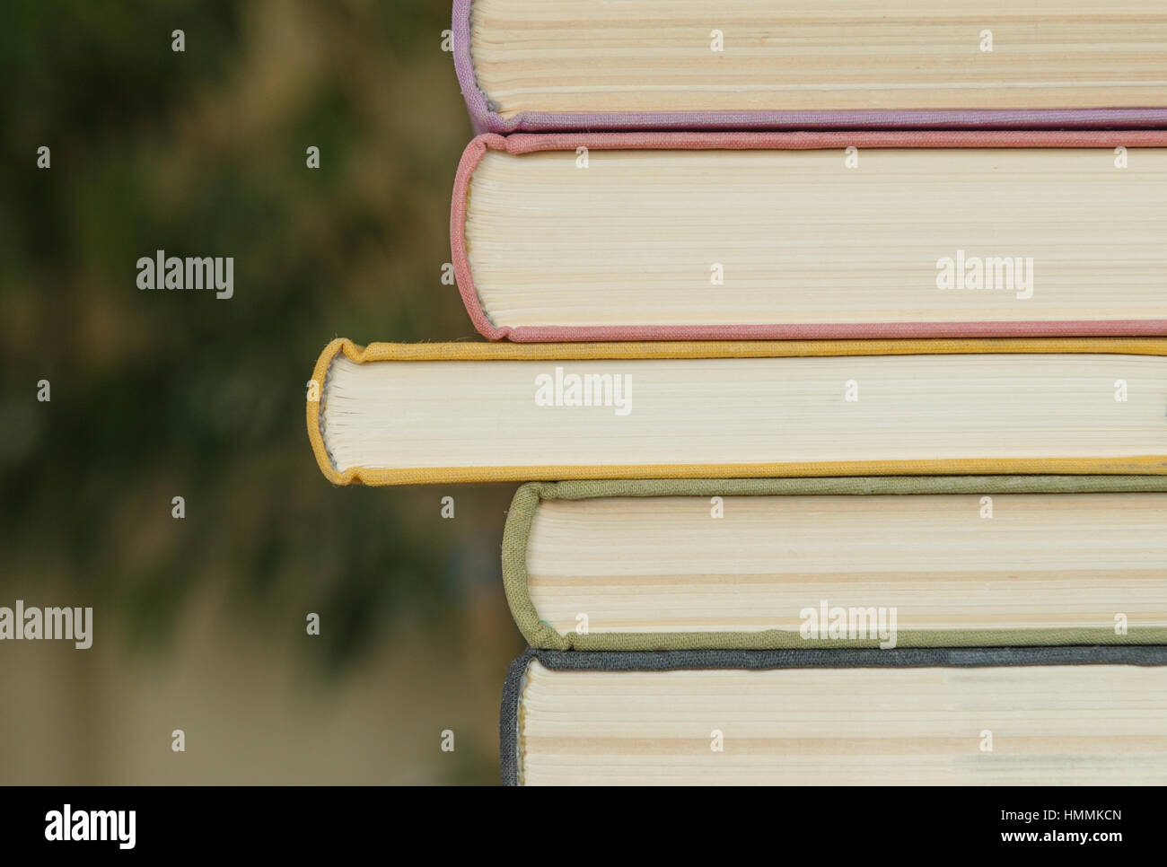 stack of colorful books in a library or a room Stock Photo - Alamy