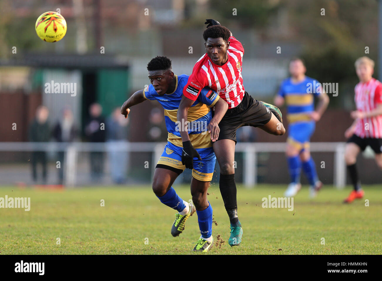 Tobi Coker of Hornchurch tangles with Ayodeji Olukoga of Romford during ...