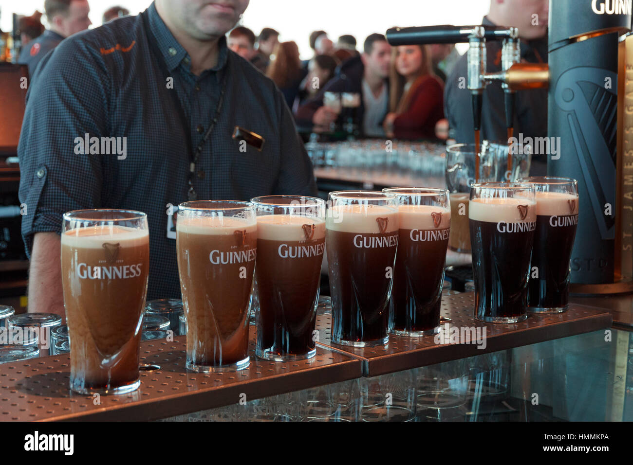 DUBLIN, IRELAND - FEB 15, 2014: Pints of beer are served at the popular ...