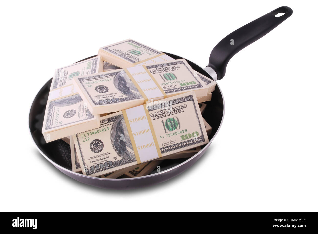 Abstract concept. Dollars in frying pan isolated on white with clipping ...
