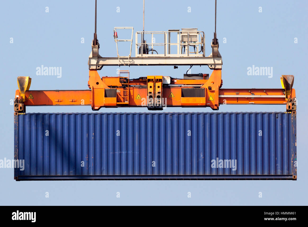Sea container lifted by a harbor crane Stock Photo - Alamy