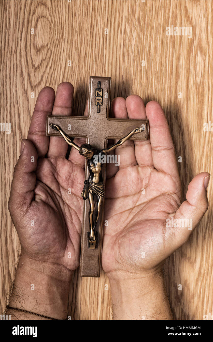 Crucifix on Hands Stock Photo - Alamy