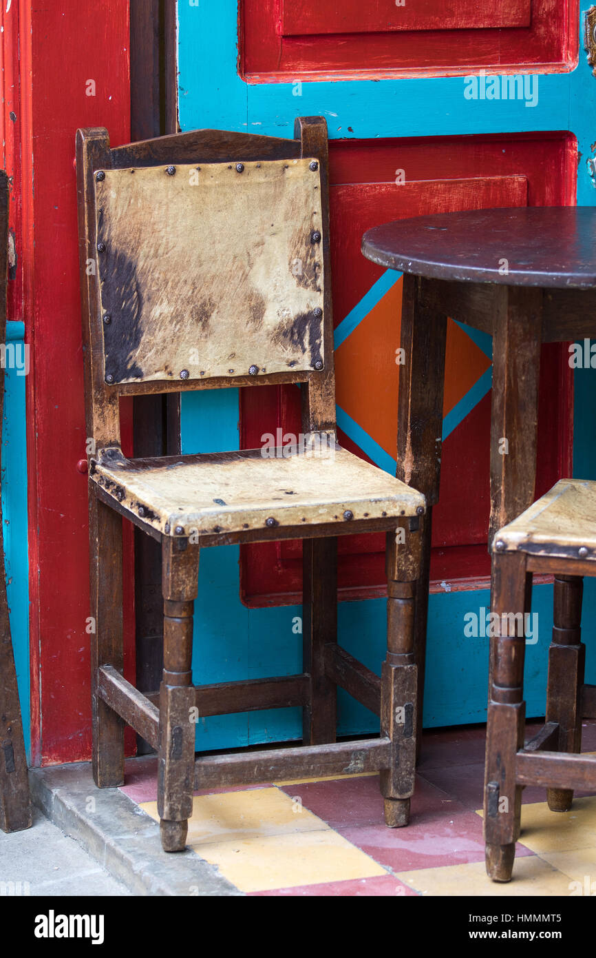 Closeup of rustic table and chair on a cafe outdoors patio Stock Photo ...