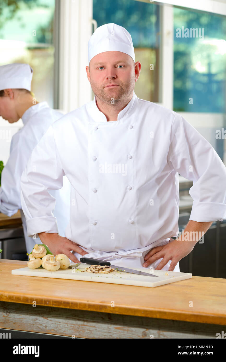 Portrait of confident chef making food in large kitchen Stock Photo - Alamy